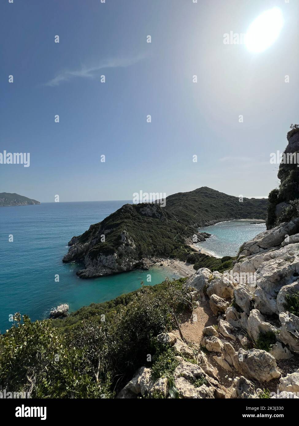 A vertical shot of the Porto Timoni beach with a beautiful seascape in ...