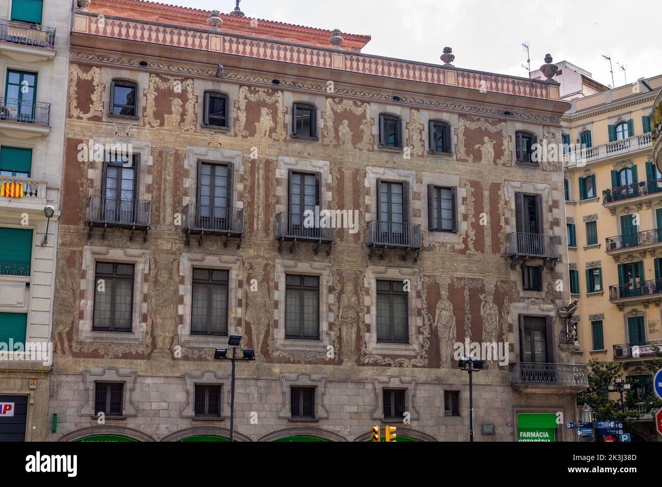 A historic stone building facade exterior in Barcelona, Catalonia ...