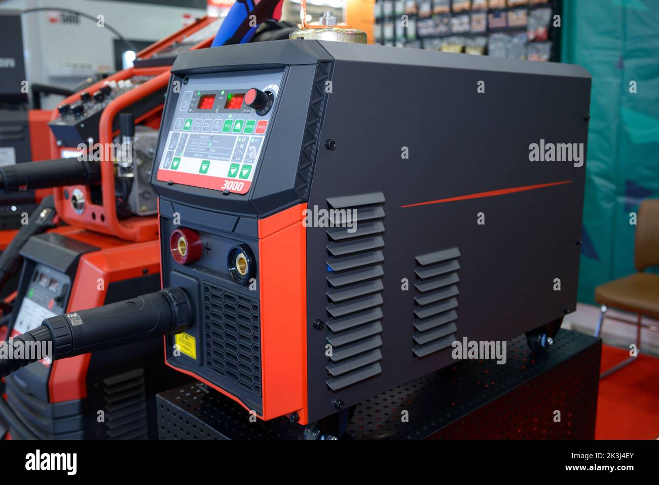 Digital industrial semi automatic welding machine placed on a stand in ...