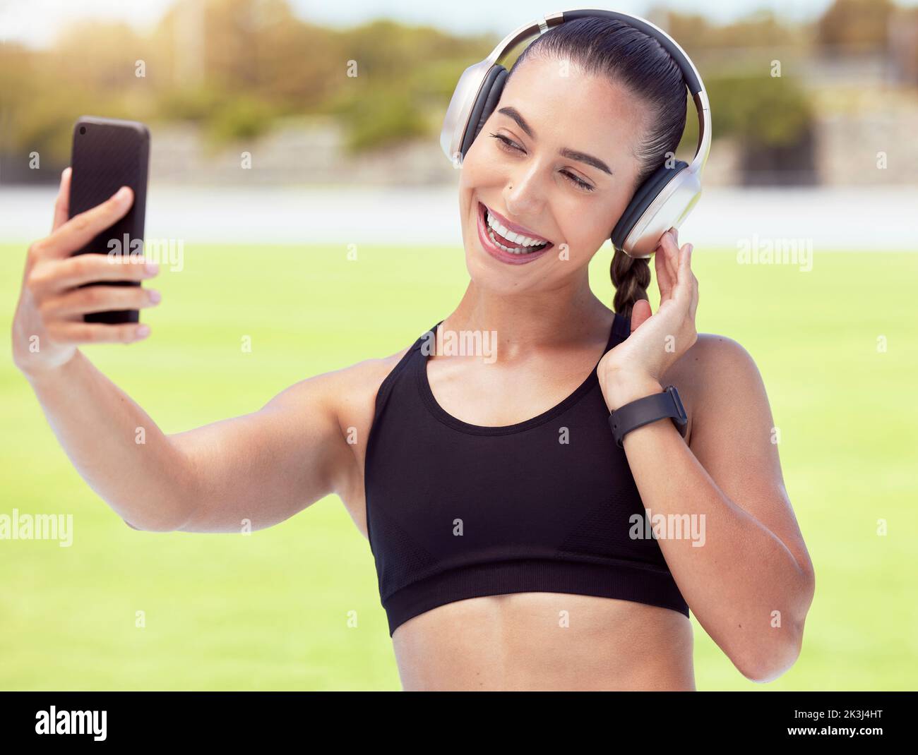 Phone, woman and fitness influencer taking a selfie at training ...