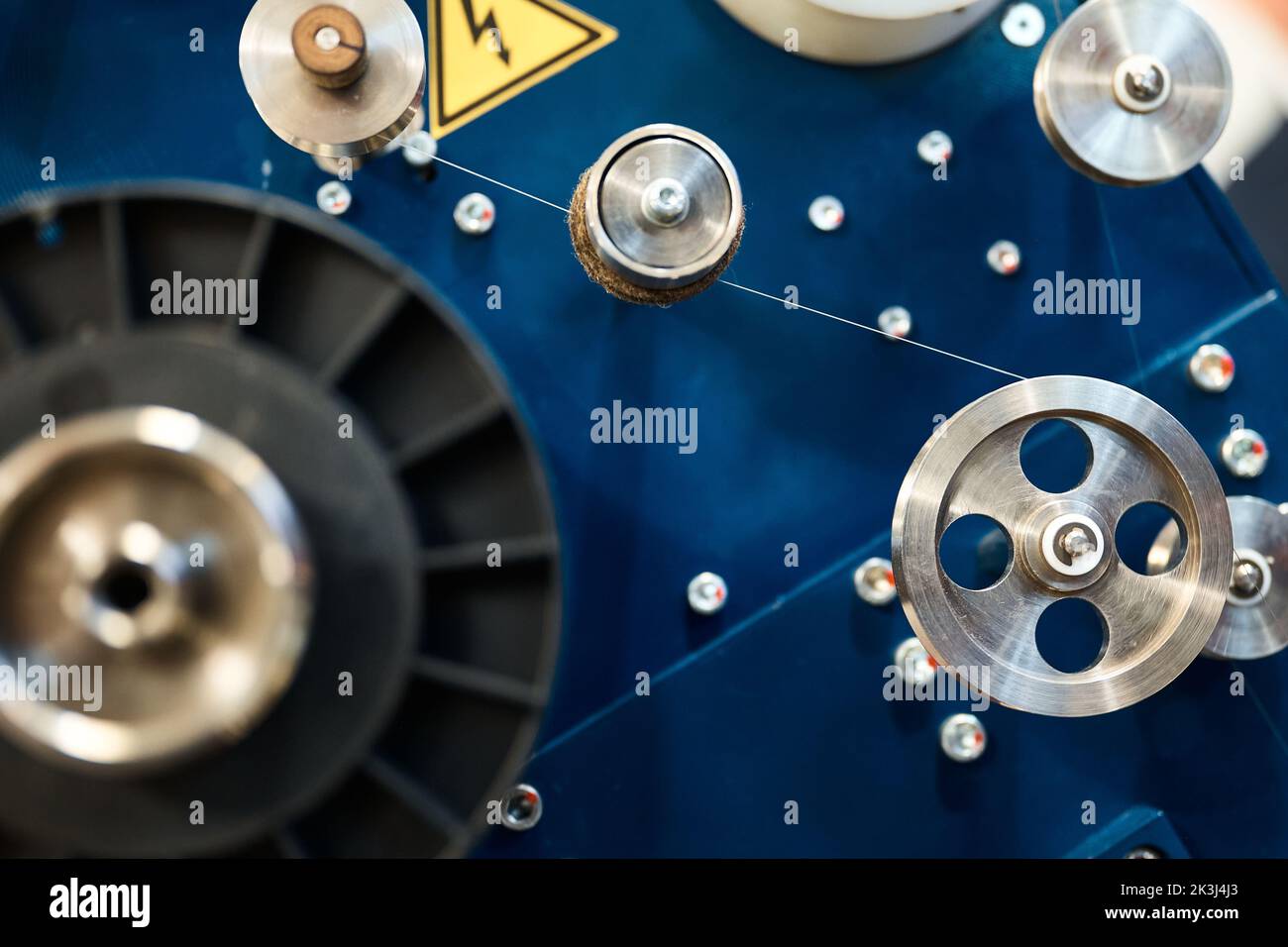 Wire feeding mechanism of electroerosive machine tool Stock Photo - Alamy