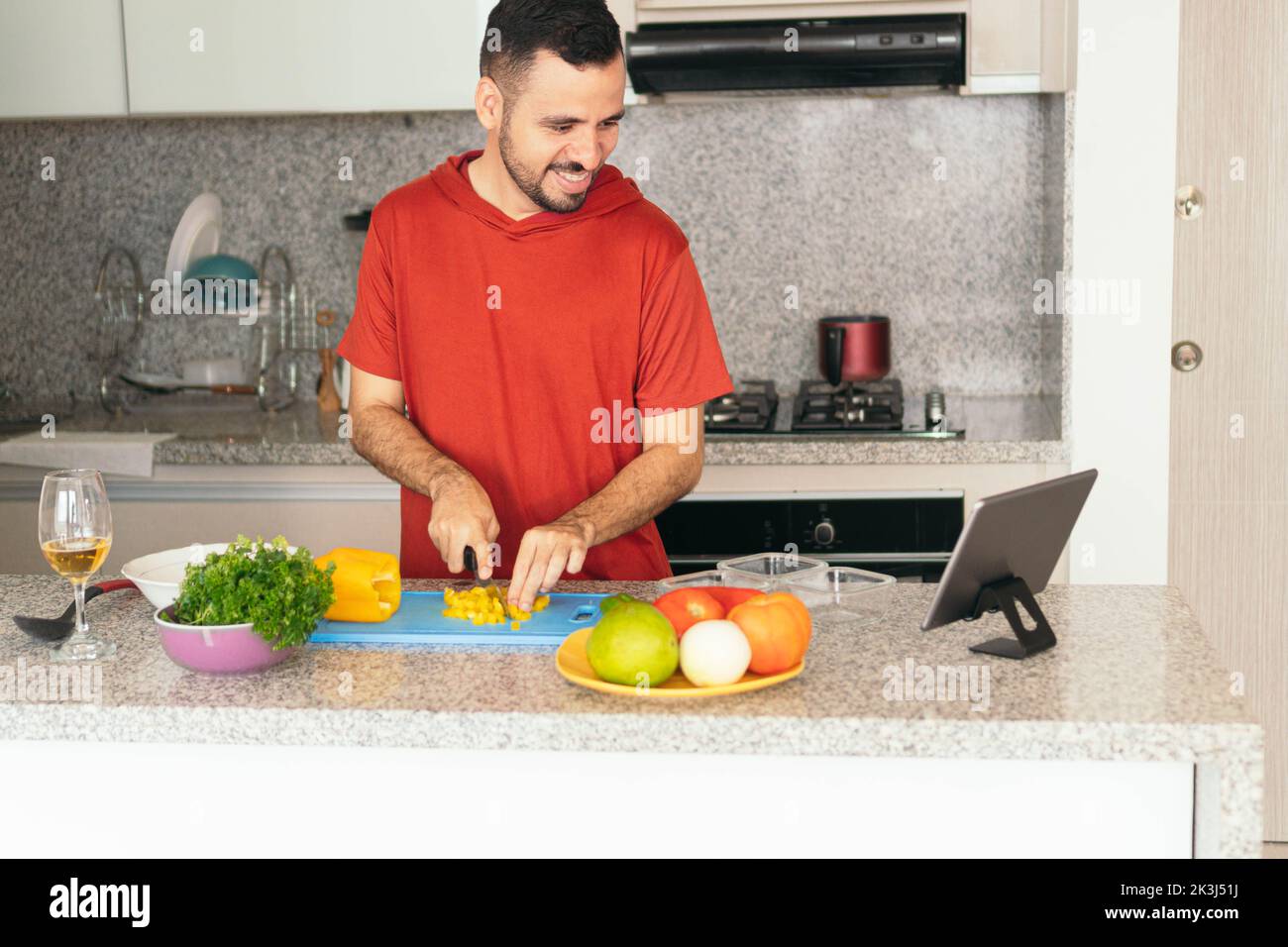 Cook making a video call while cooking in the house Stock Photo - Alamy