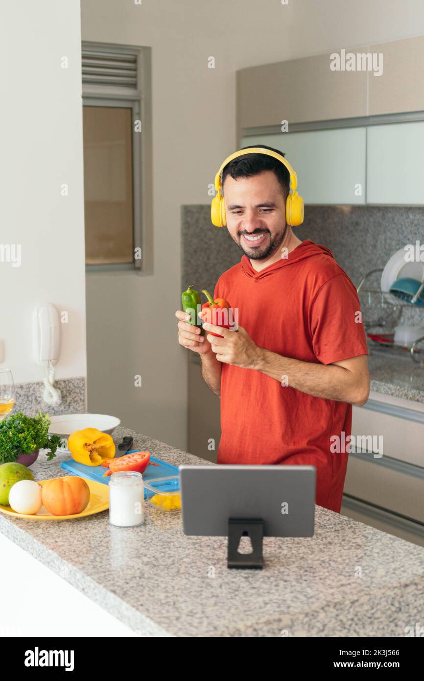 Hispanic man doing video chat hi-res stock photography and images - Alamy