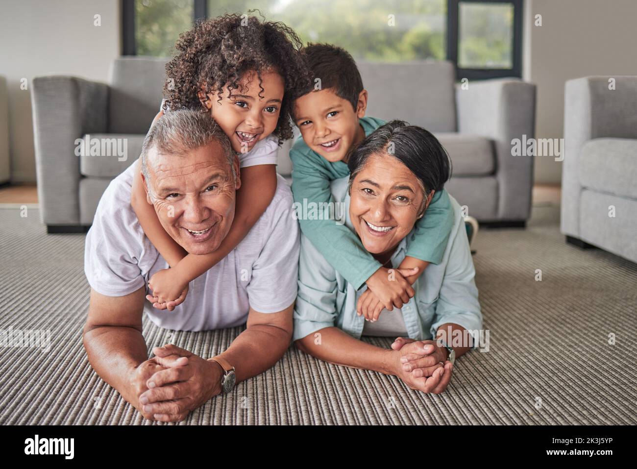 Mature woman grandchild play face hi-res stock photography and images ...