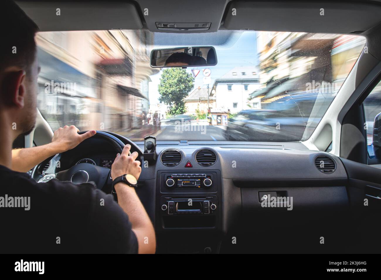 Hands on the wheel when driving at high speed from inside the car Stock Photo - Alamy
