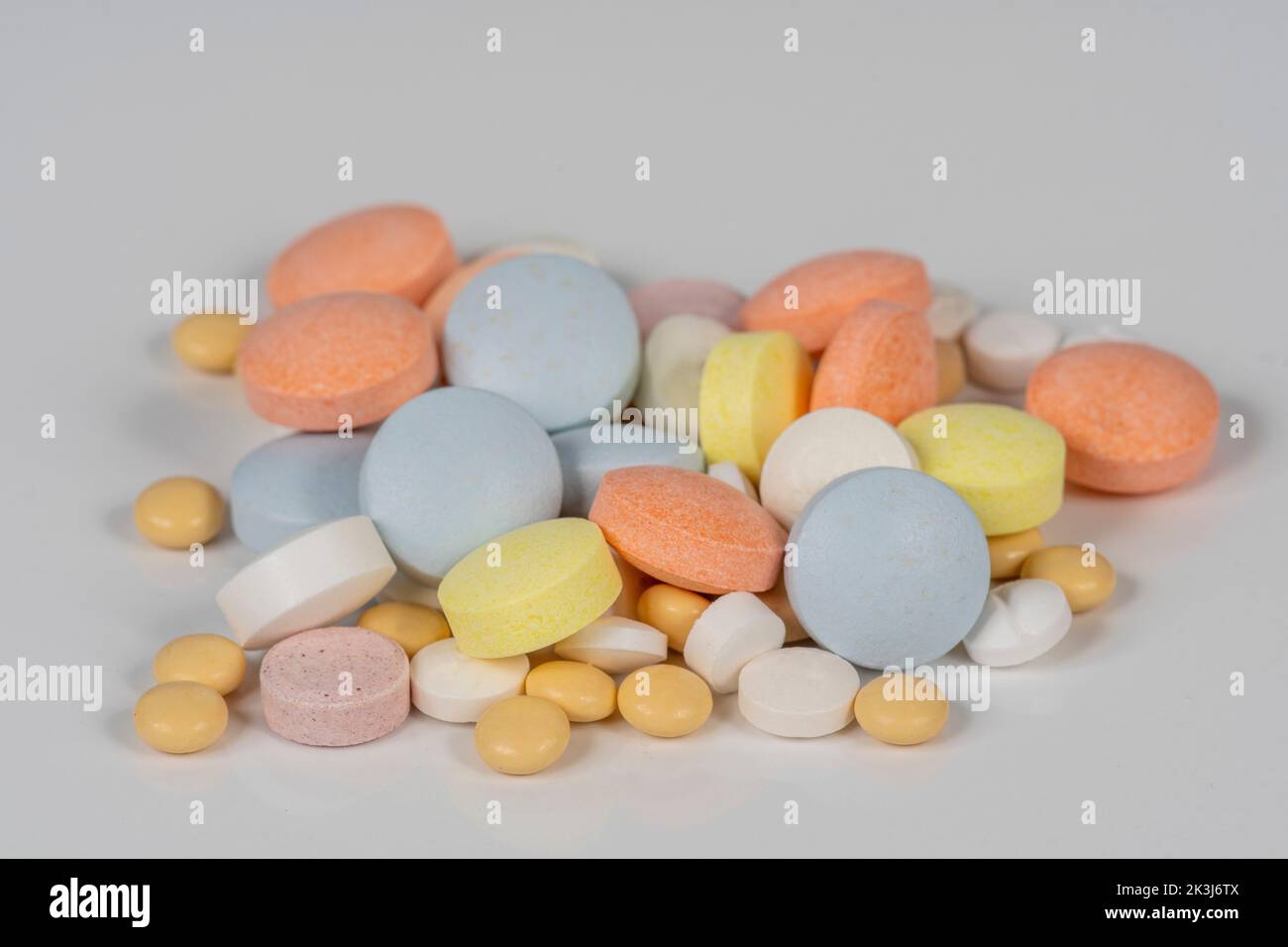Medicines (tablets, capsules, pills) of different sizes and colors ...