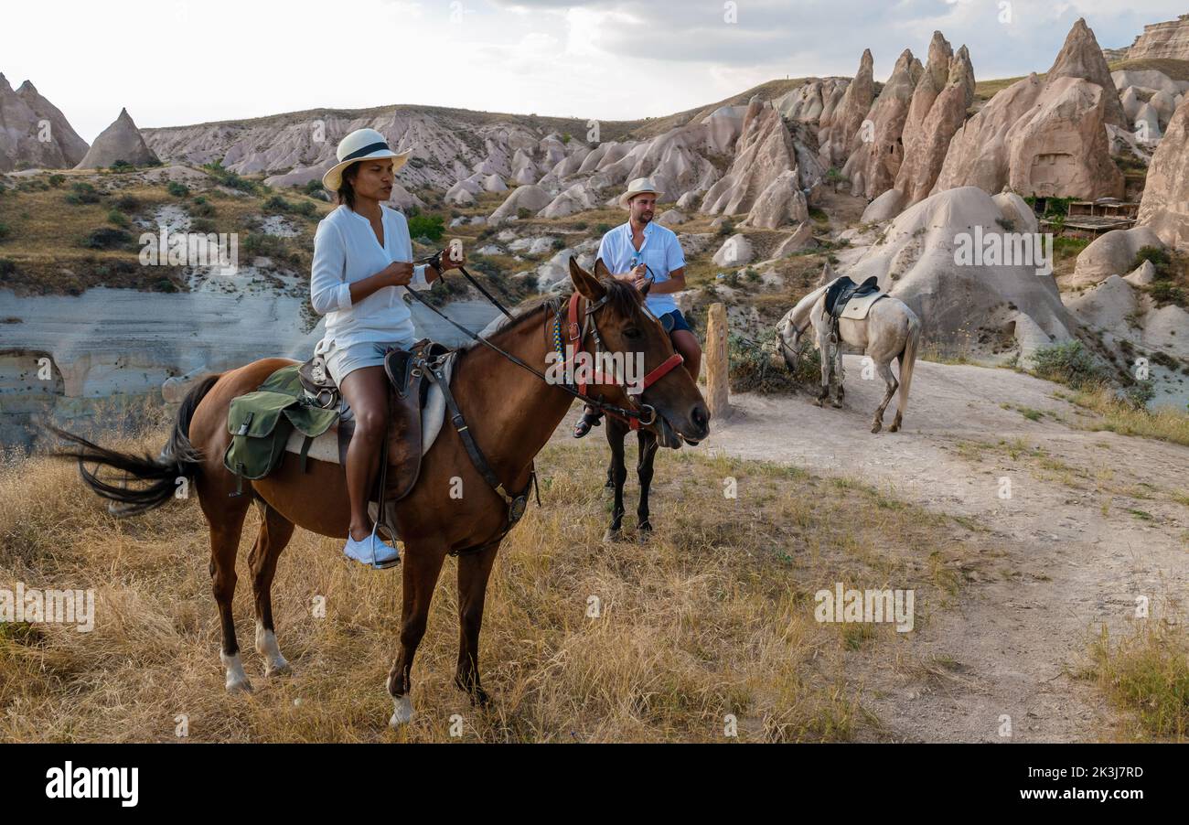 happy young couple on vacation in Turkey Kapadokya horse riding in the ...