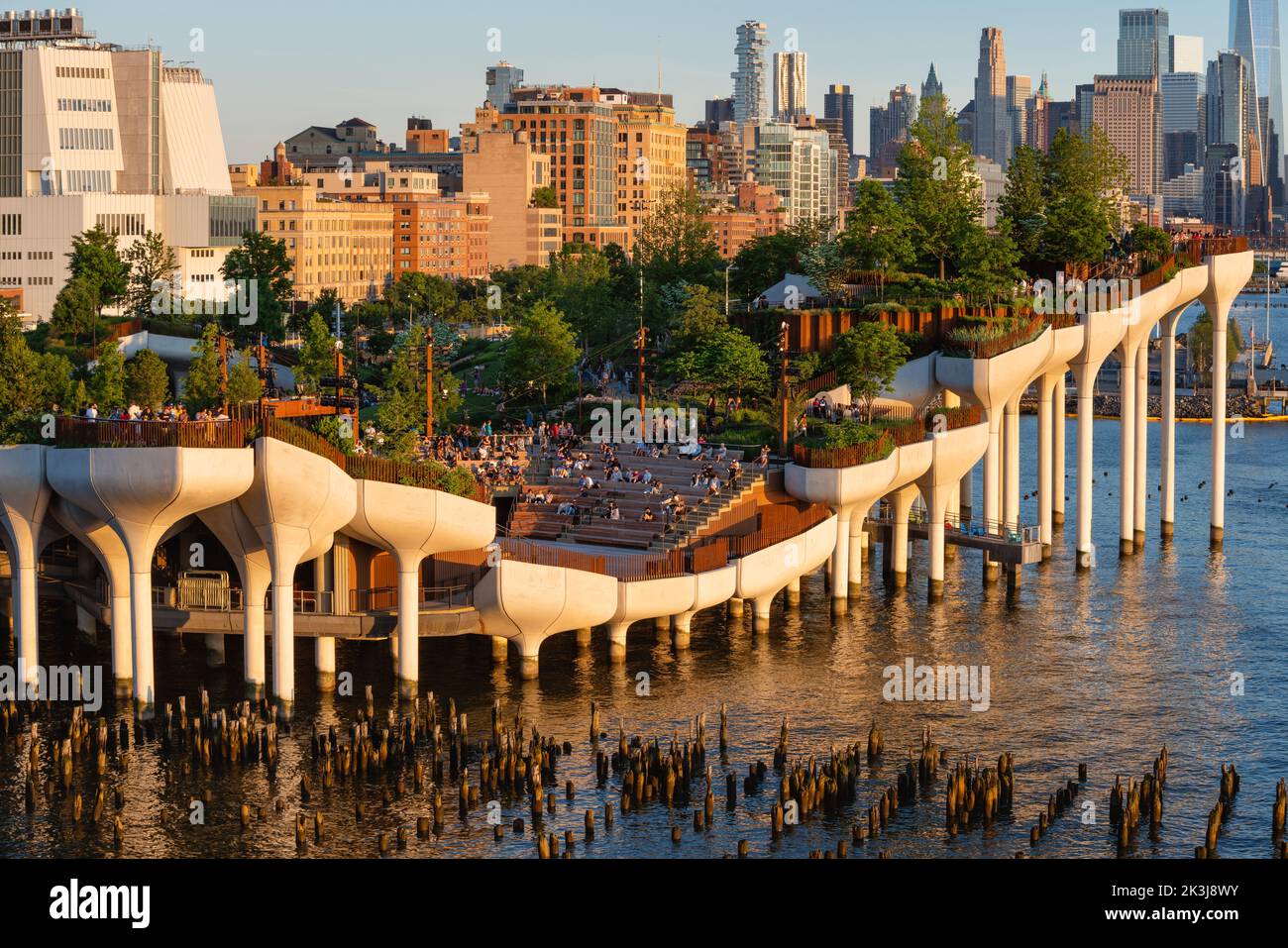 New York City, Little Island public park at sunset. Elevated park with amphitheater at Hudson ...