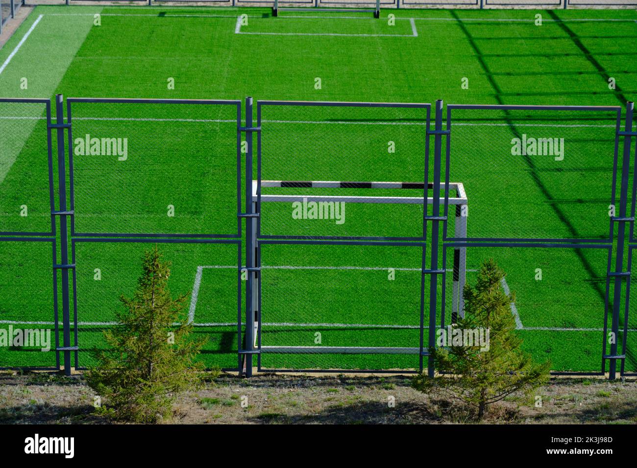 Football field with gate and freshly laid green lawn Stock Photo - Alamy
