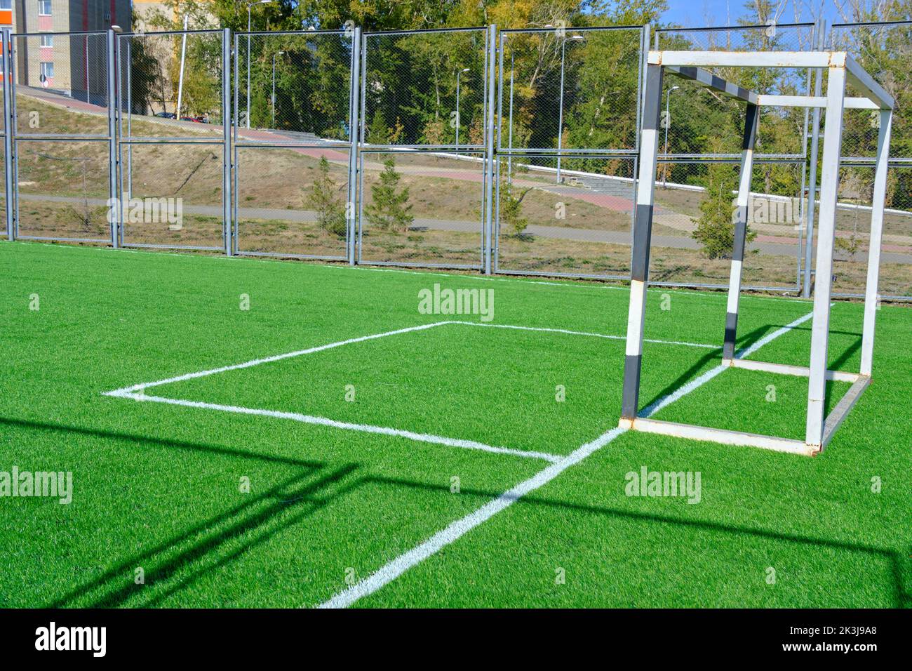 Football field with gate and freshly laid green lawn Stock Photo - Alamy