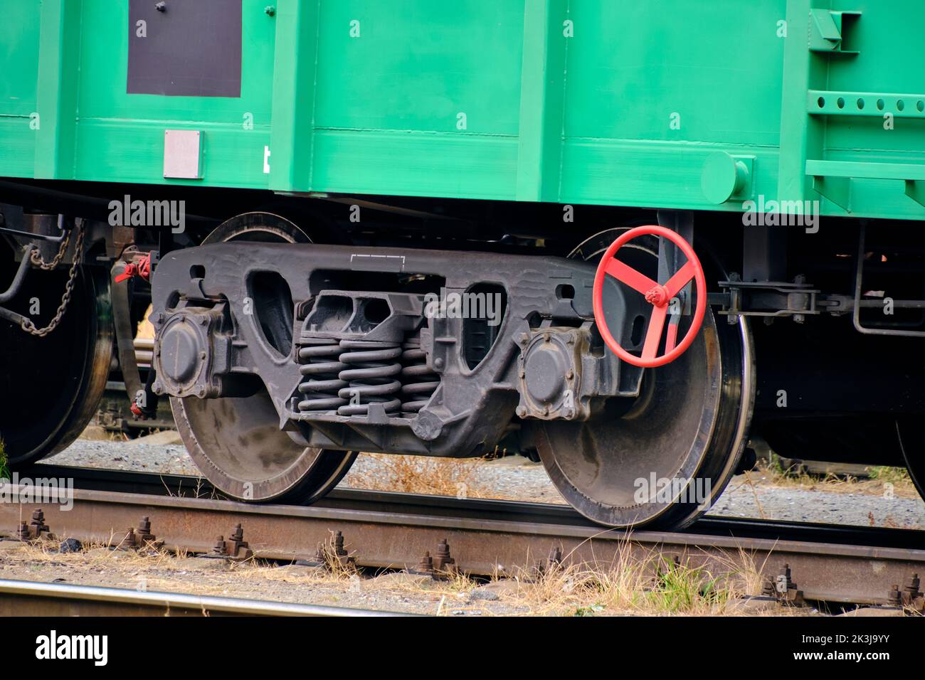 Steel wheelset of railway cars on rails Stock Photo - Alamy