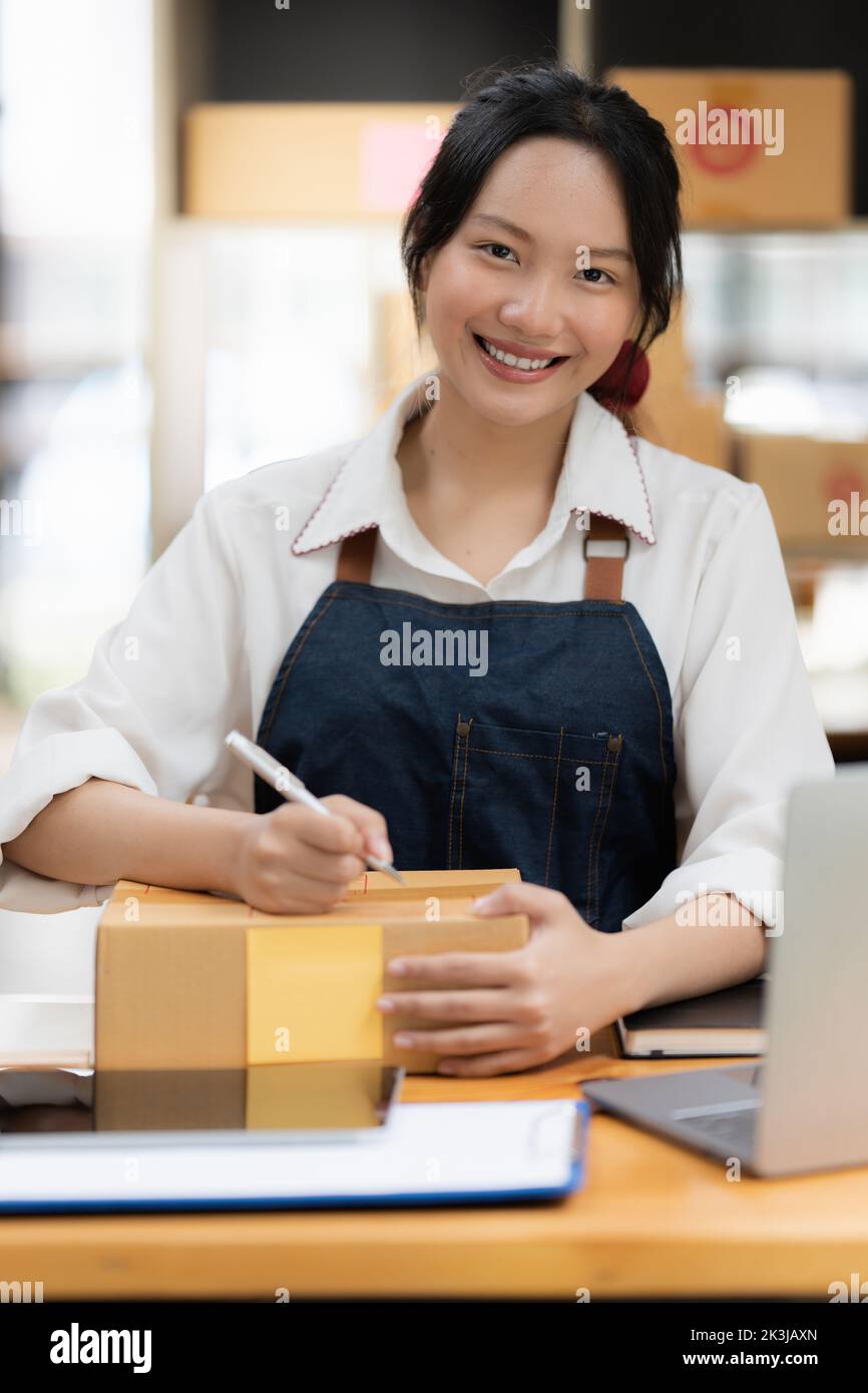 Asian small business owner working at home office. Business retail ...