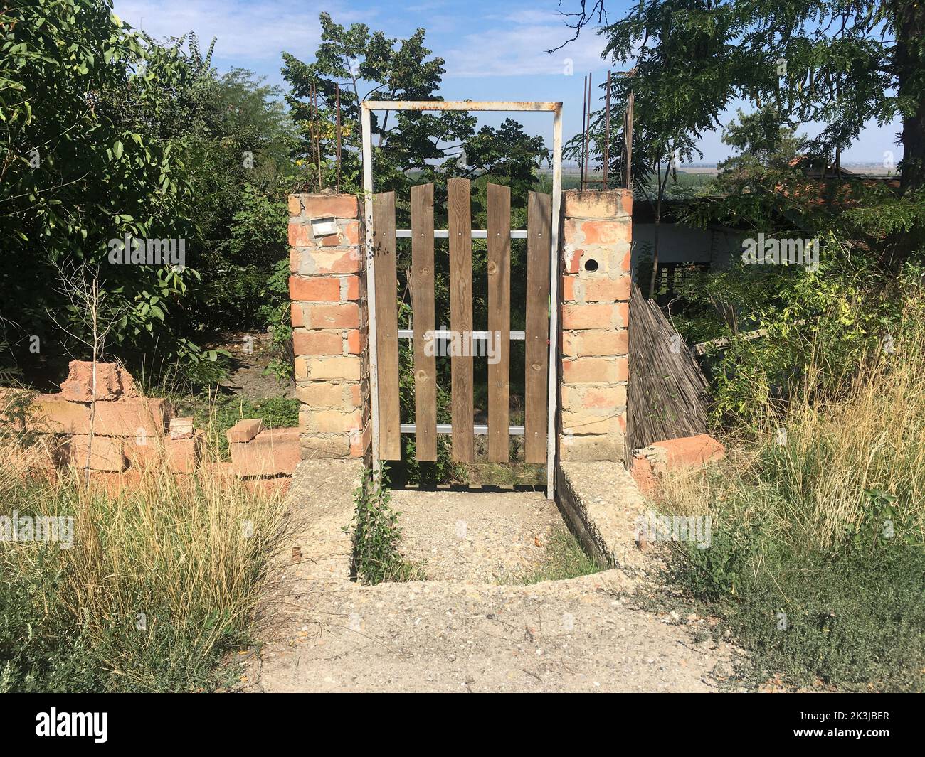 a small gate without fences on left and right side Stock Photo - Alamy