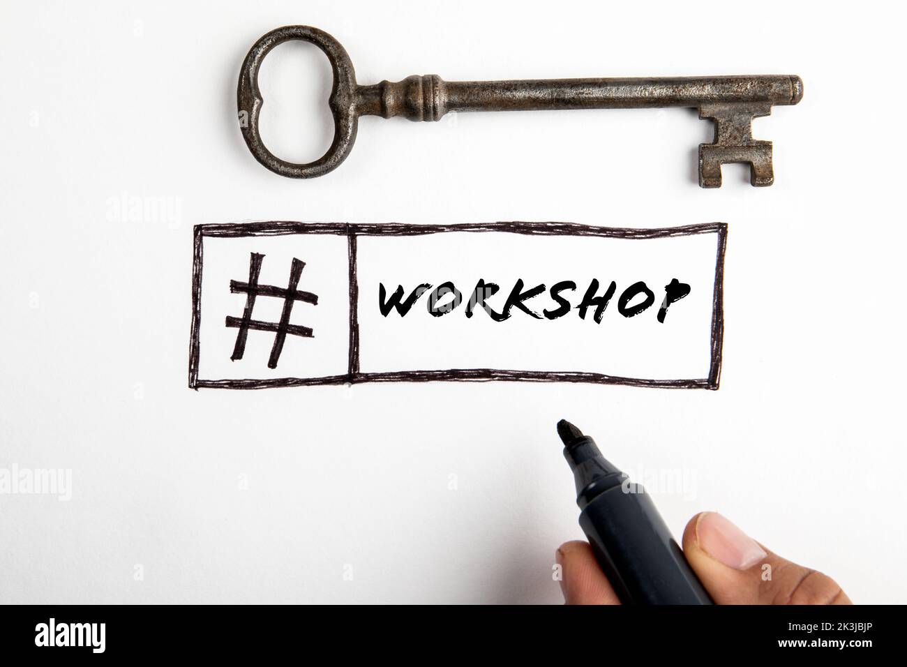 Workshop hashtag. Text and old door key on white background Stock Photo ...