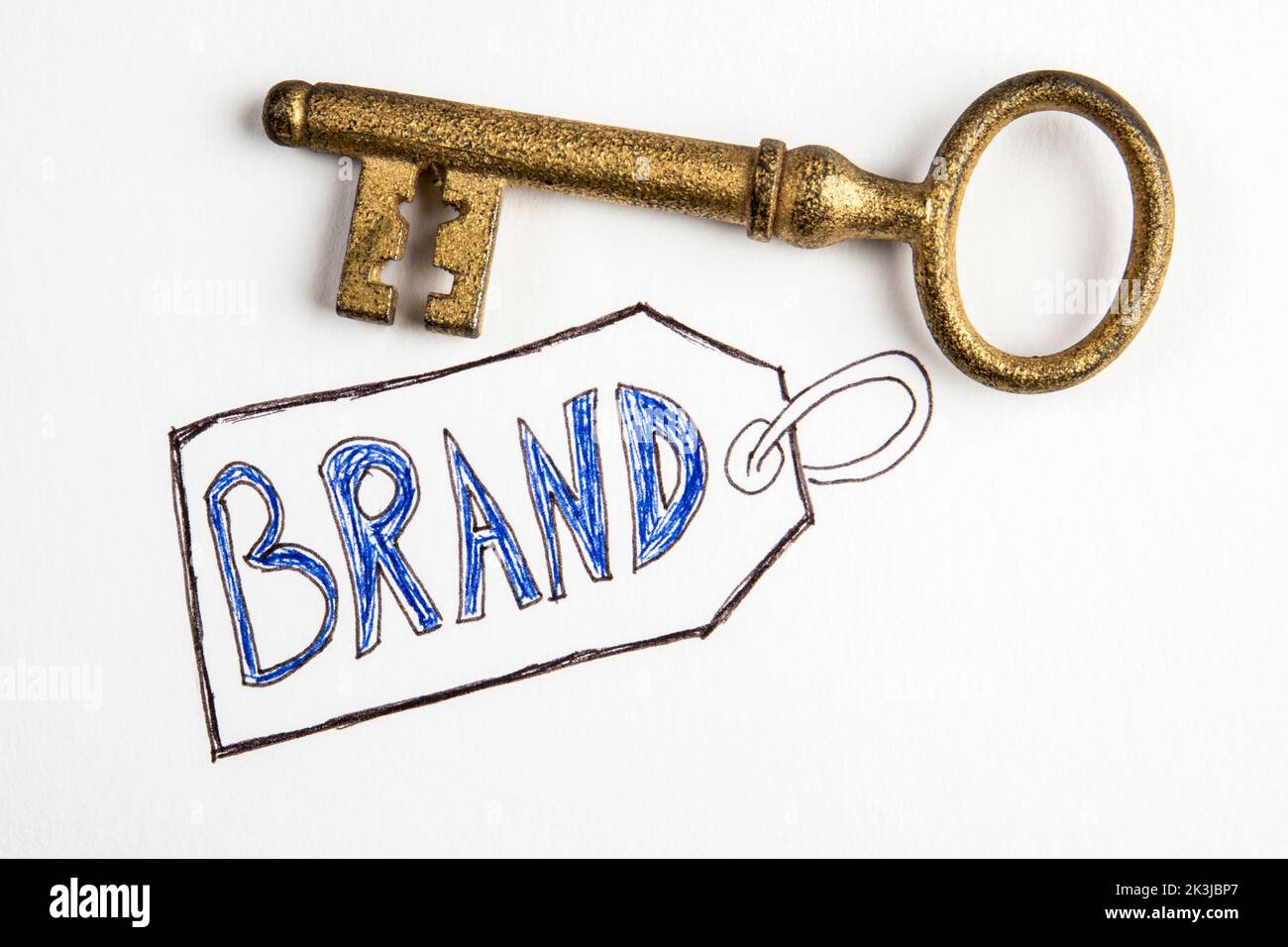 Brand, business concept. Gilded door key on a white background Stock ...