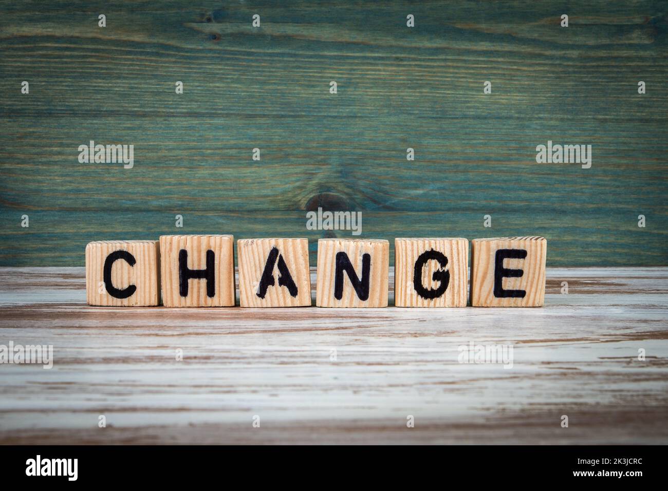 CHANGE. Wooden alphabet letters on a green and white background Stock ...