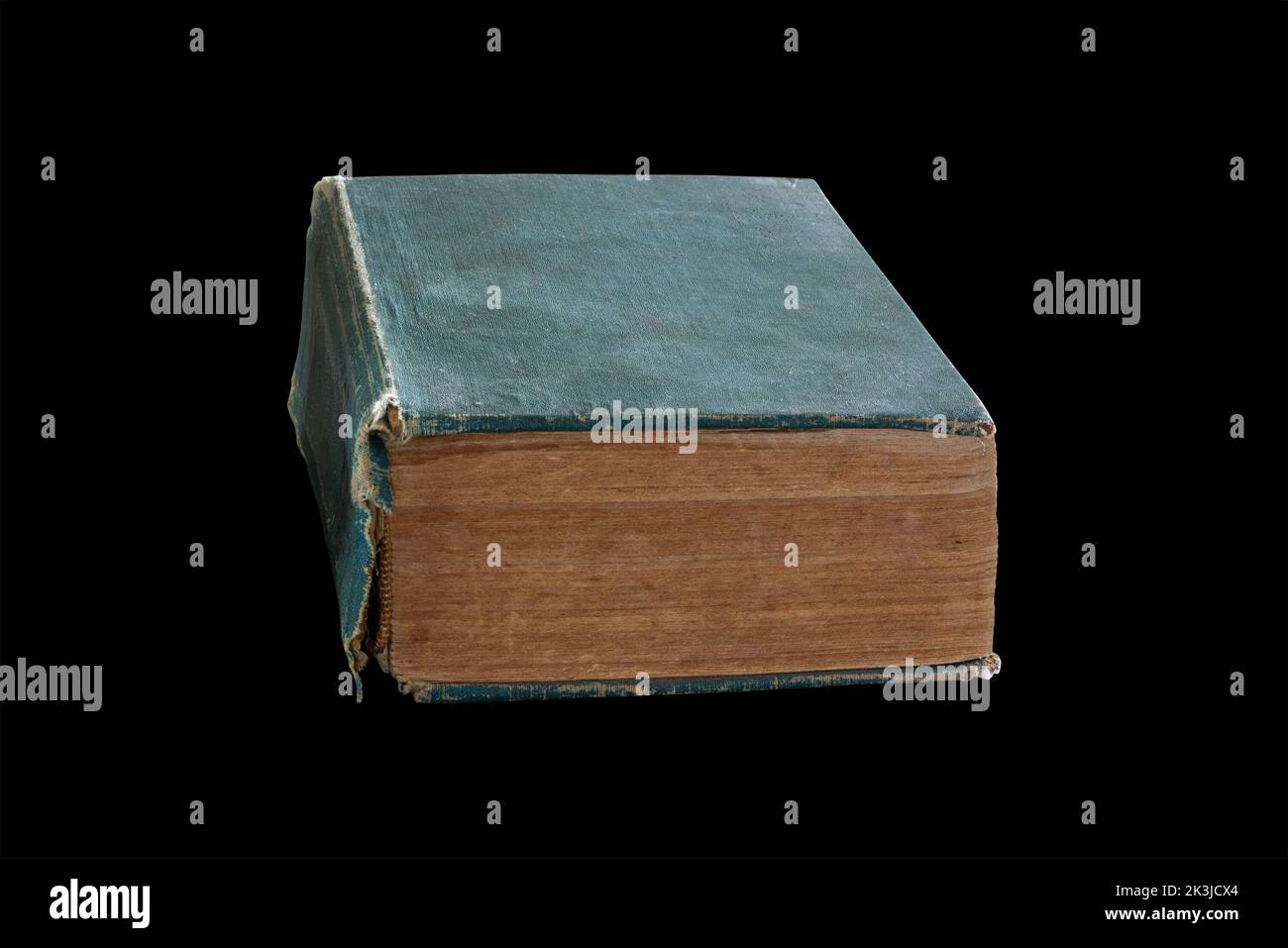 An old thick book with a green torn cover isolated on a black background with Stock Photo - Alamy