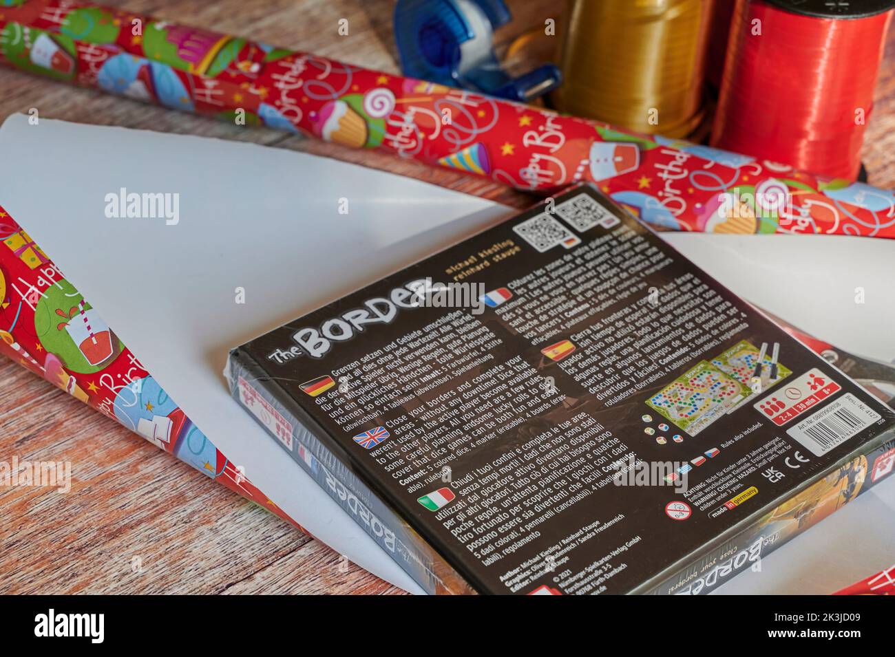 Berlin, Germany - September 25, 2022: Board game with wrapping paper ...