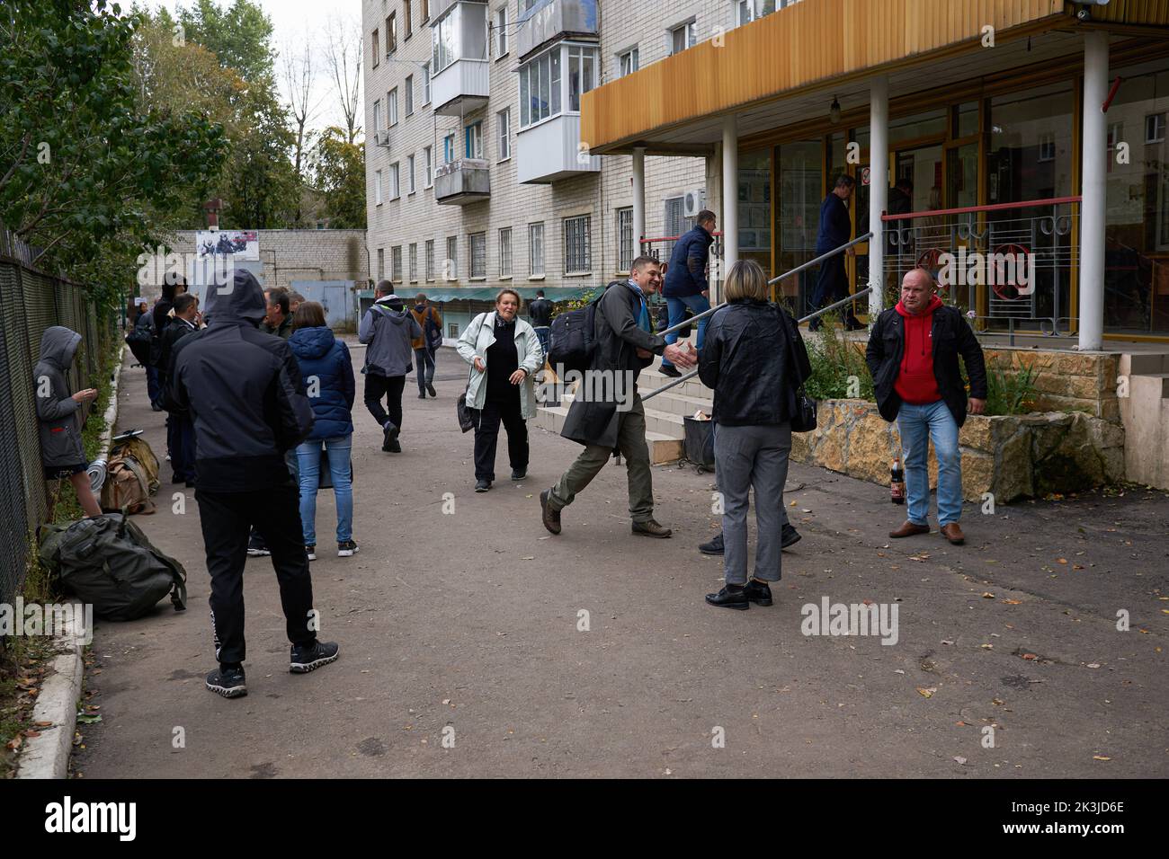 People seen at the entrance to the military enlistment office during ...
