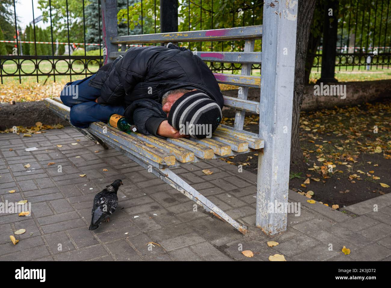 A homeless man sleeps on a bench during mobilization in Voronezh. On ...