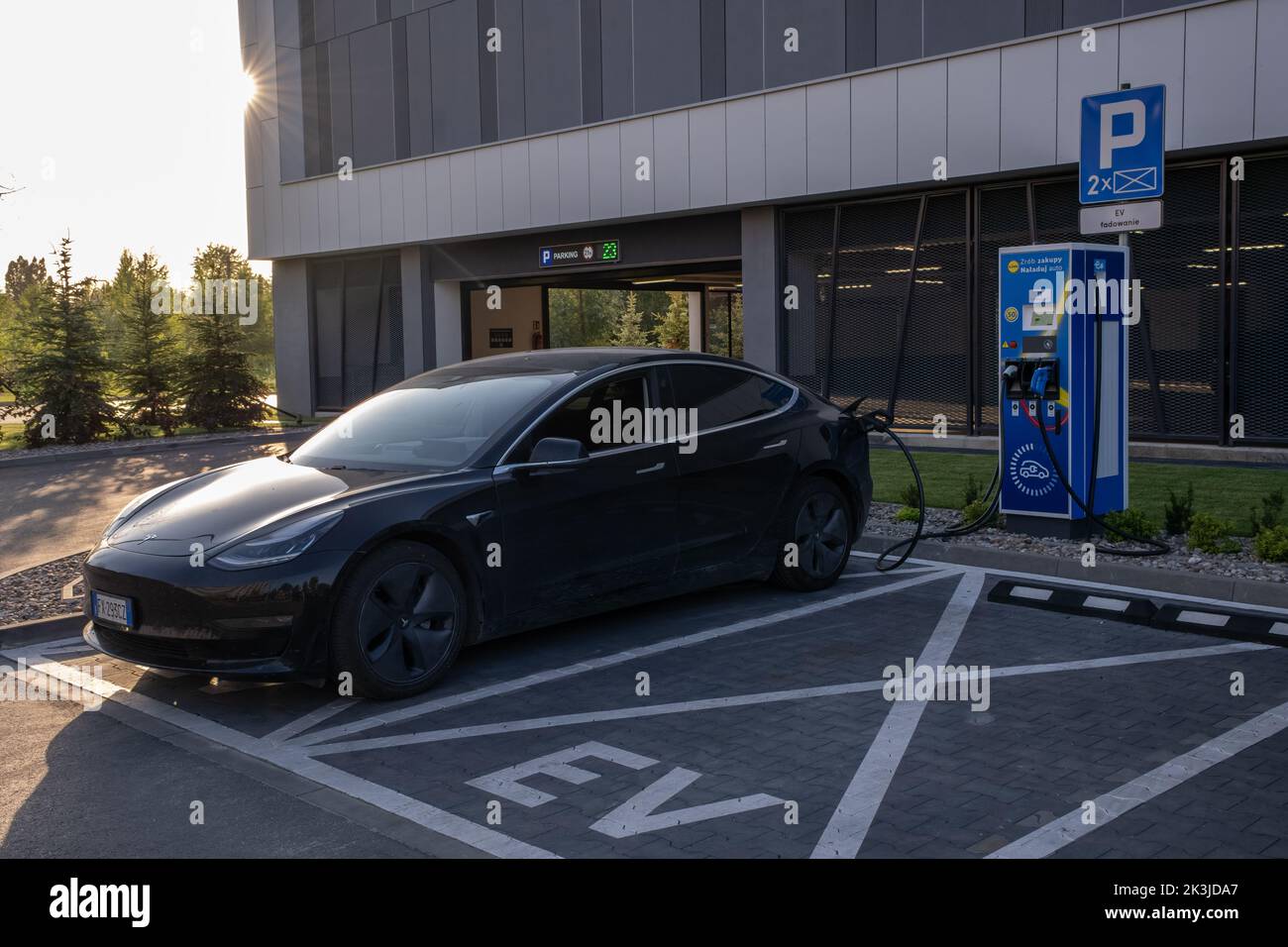 Warsaw, Poland - August 25, 2022: A static shot of a solid black Tesla ...