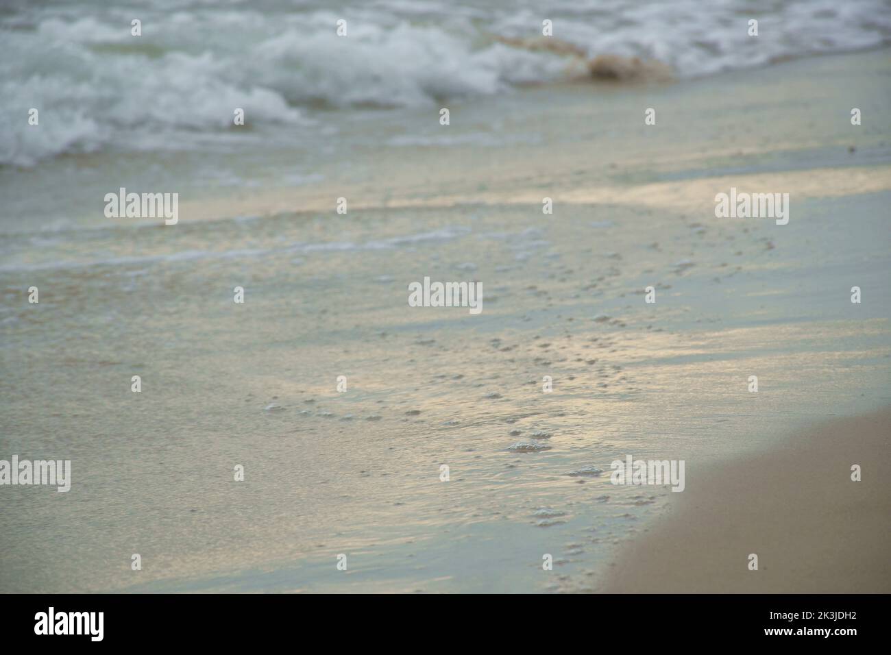salt water sea impact to beach with reflection of sunlight Stock Photo ...