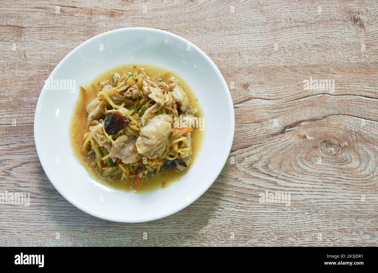stir fried chicken with slice ginger and black ear mushroom on plate ...