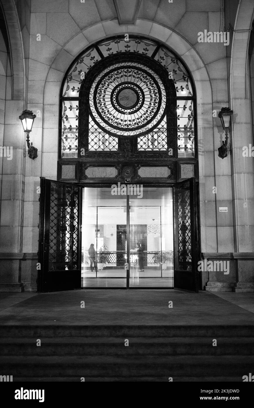 A grayscale of an arched Ornate shop front Stock Photo - Alamy
