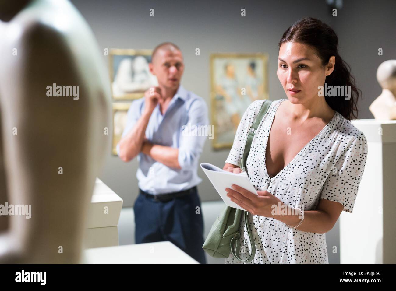 woman admiring art work Stock Photo - Alamy