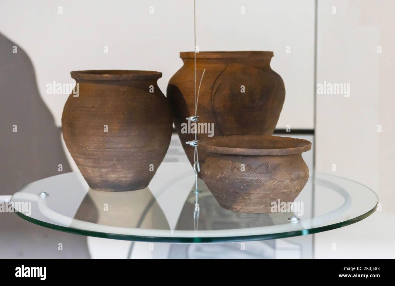 Three clay pots on display at the museum, close-up, exhibition Stock ...
