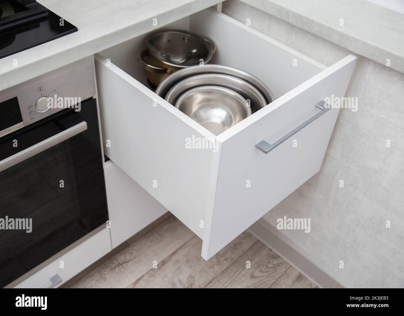 Modern sliding drawer system in the kitchen. Production of kitchen ...