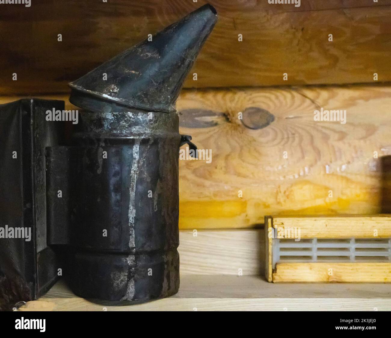 smoker for bees on a wooden background. Breeding bees and extracting ...