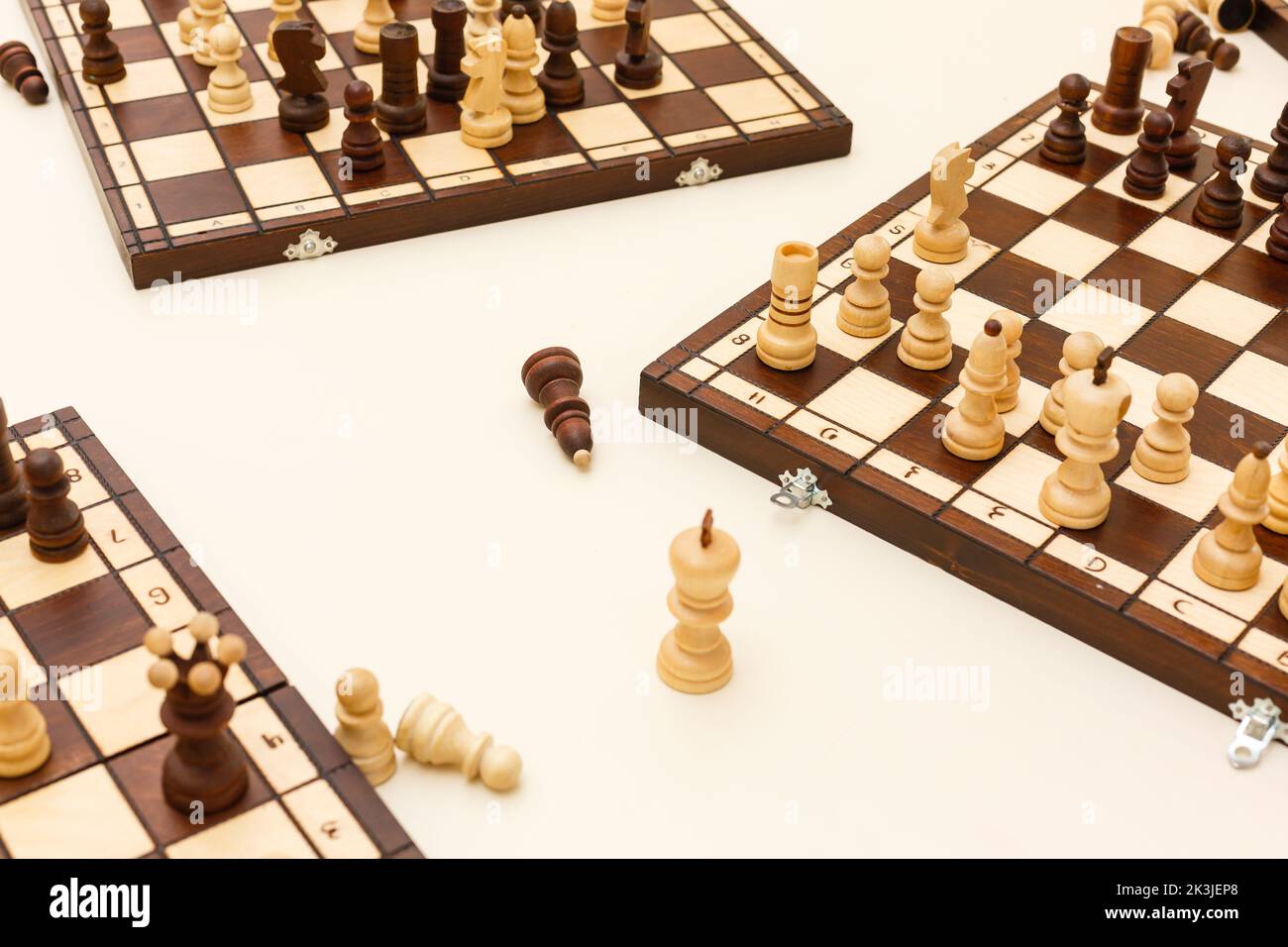 Chess boards and wooden chess pieces. Three chessboards for indoor ...