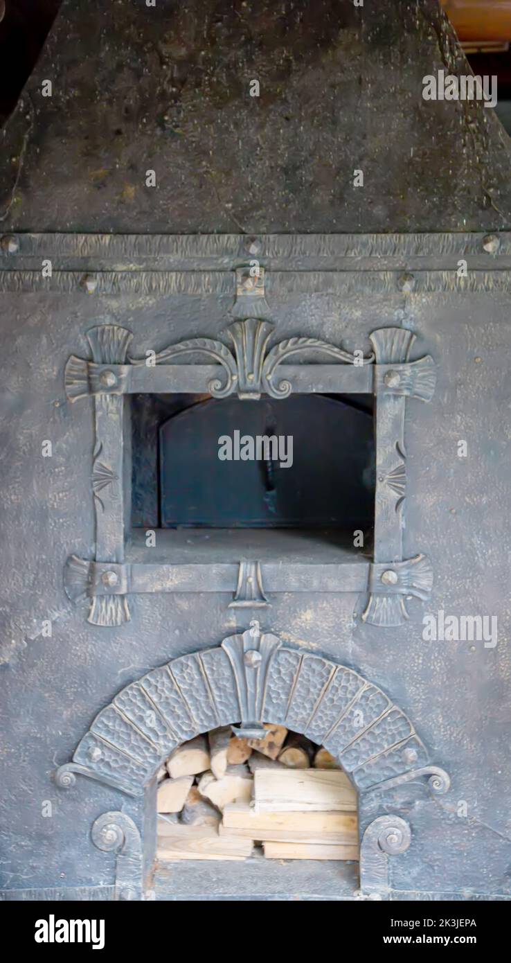 forged handmade metal stove for wood burning, close-up Stock Photo - Alamy