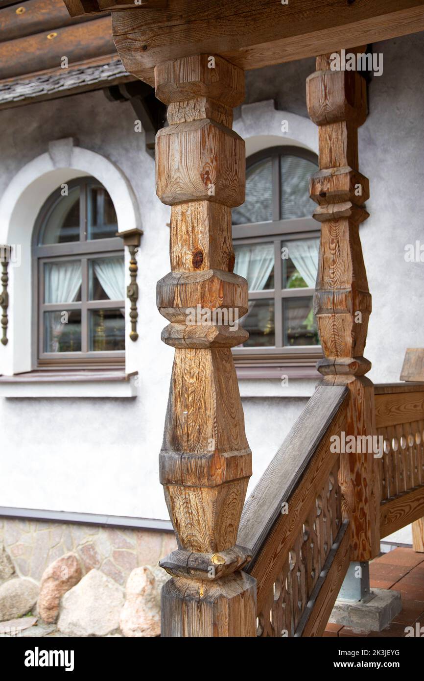 Beautiful carved wooden columns on the porch of a country house Stock ...