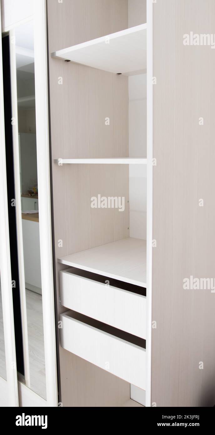 White closet with shelves for clothes in the hallway, close-up Stock ...