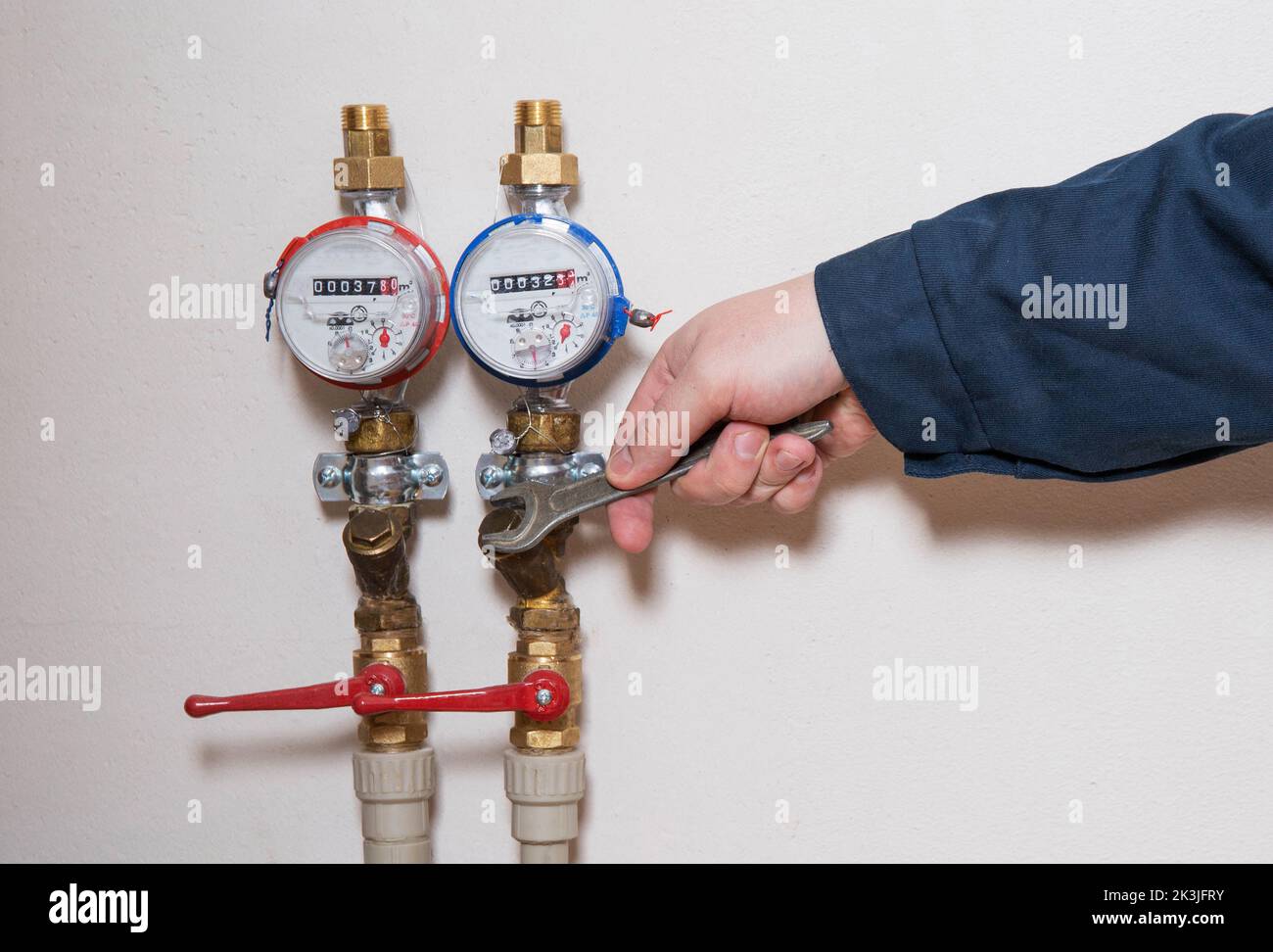 an employee removes water meters to check and replace new ones ...