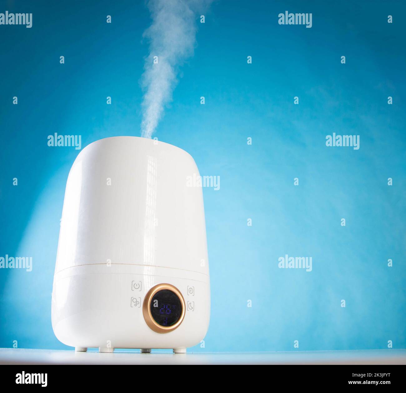 Modern device for air humidification on a blue background. Wet Steam ...