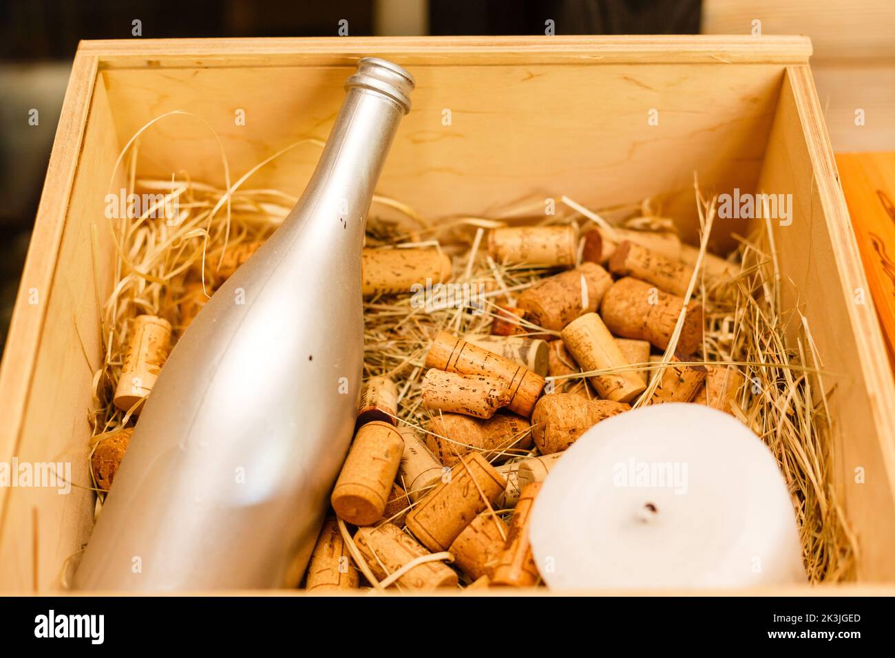 Bottles of wine in wooden box. Wine box filled with bottle corks and ...