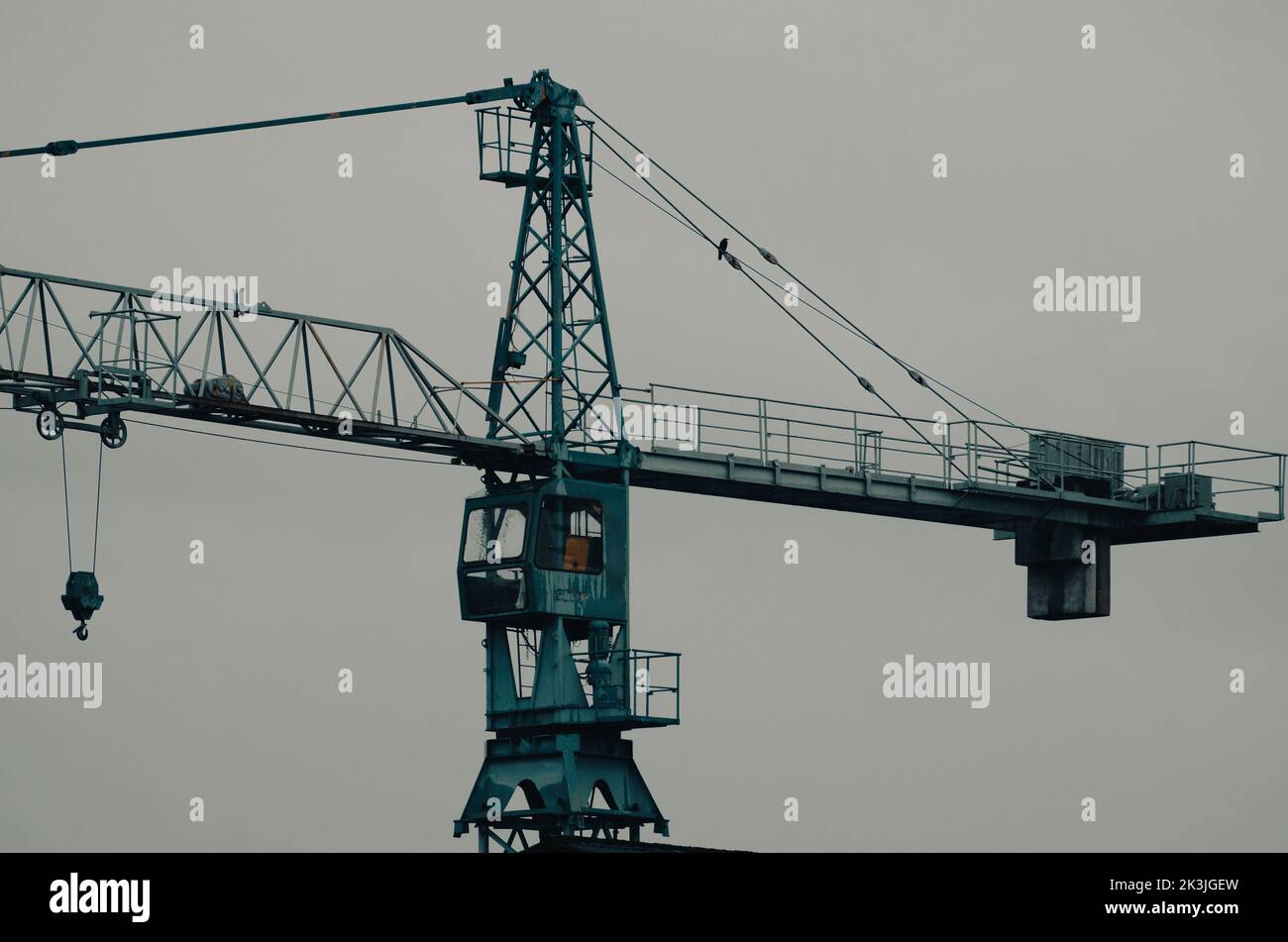 Middle part of a construction crane after the rain. The mood is gloomy ...