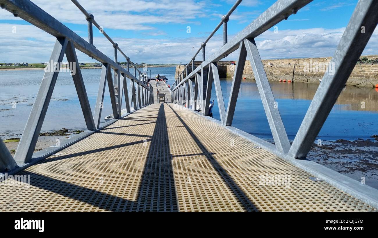 A walkway into the sea from the harbor Stock Photo - Alamy