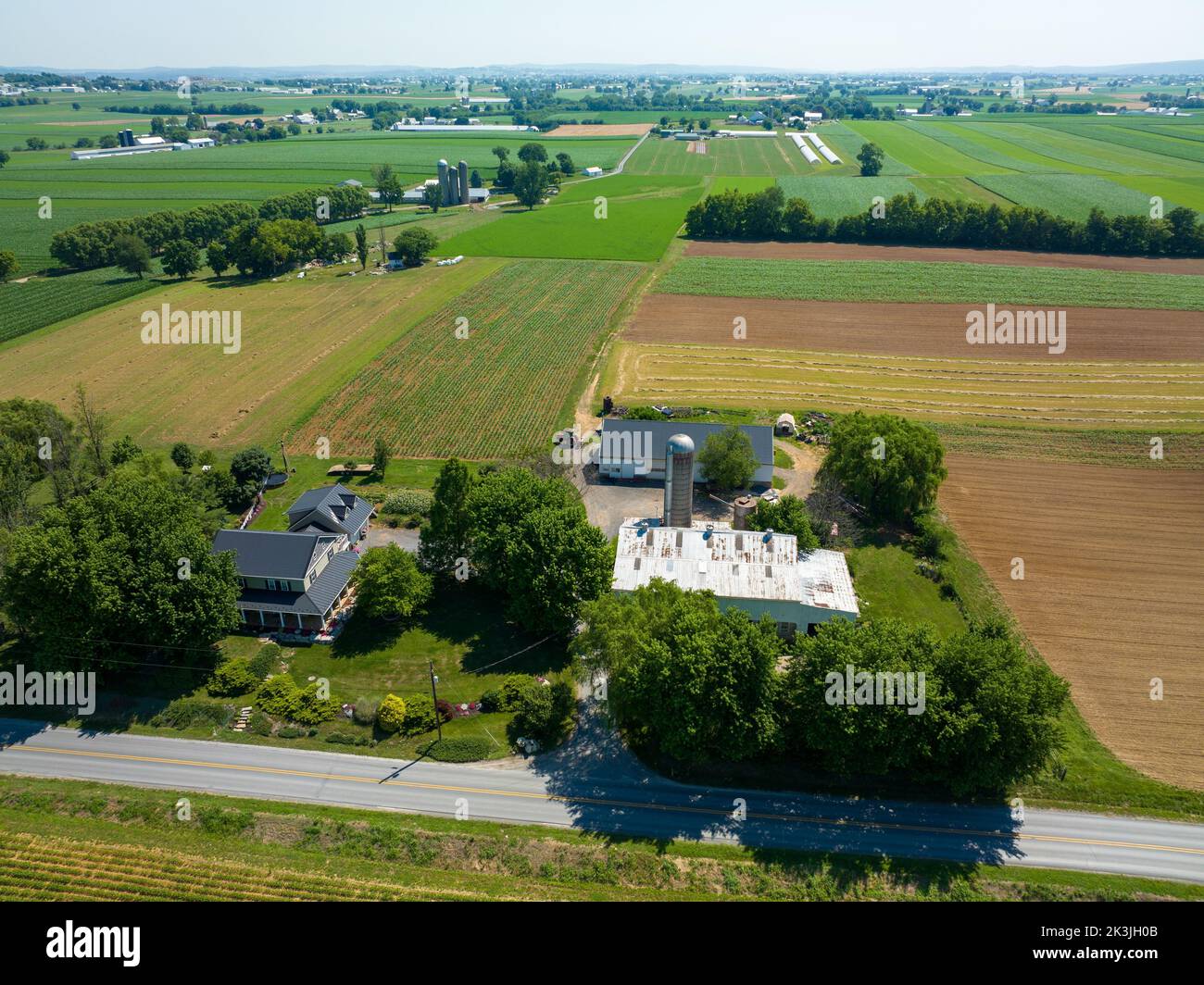 An aerial view of a countryside area with fields and houses Stock Photo ...