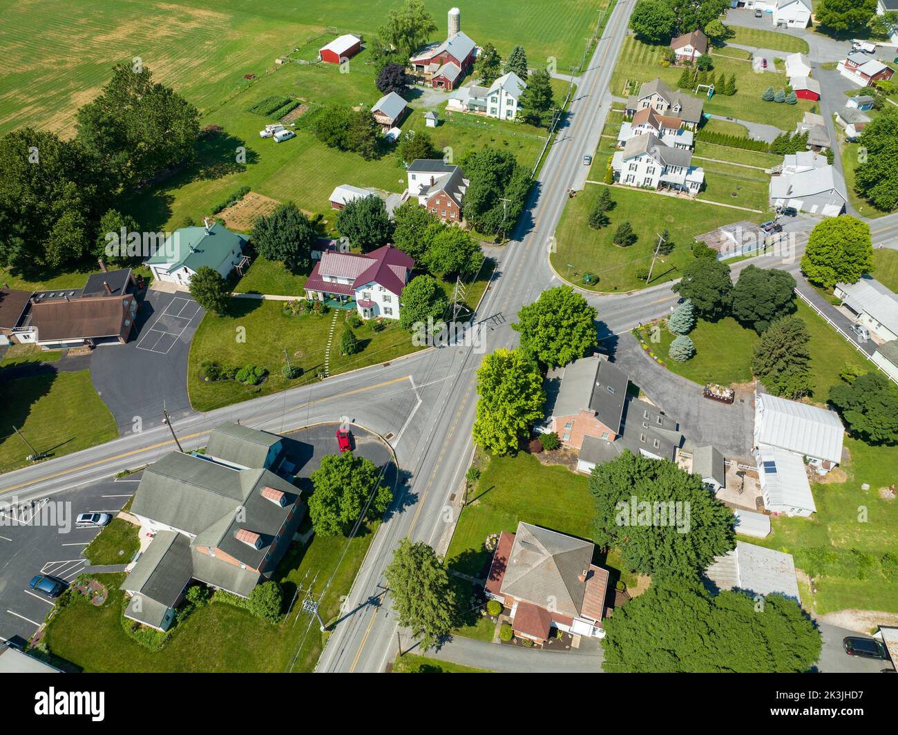 An aerial view of a countryside area with fields and houses Stock Photo ...