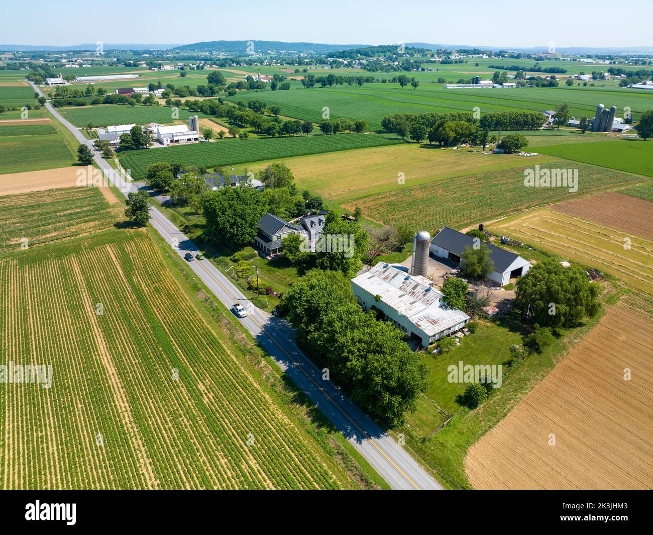 An aerial view of fields and houses in the countryside area Stock Photo ...