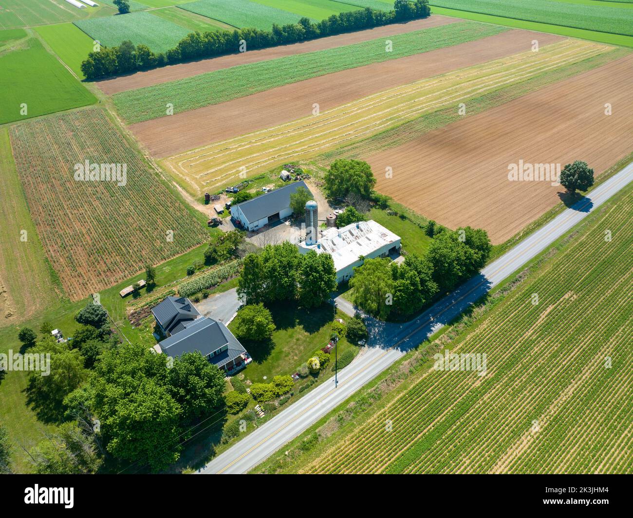 An aerial view of fields and houses in the countryside area Stock Photo ...