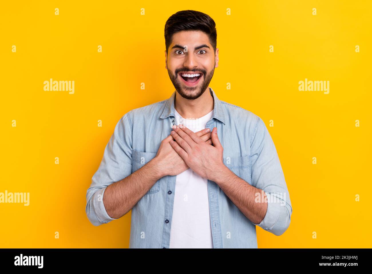 Portrait of young thankful guy wear denim shirt open mouth got surprise ...