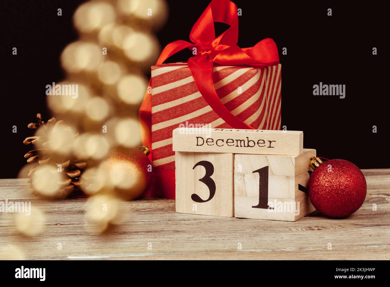 Christmas table decor with a gift box Stock Photo - Alamy