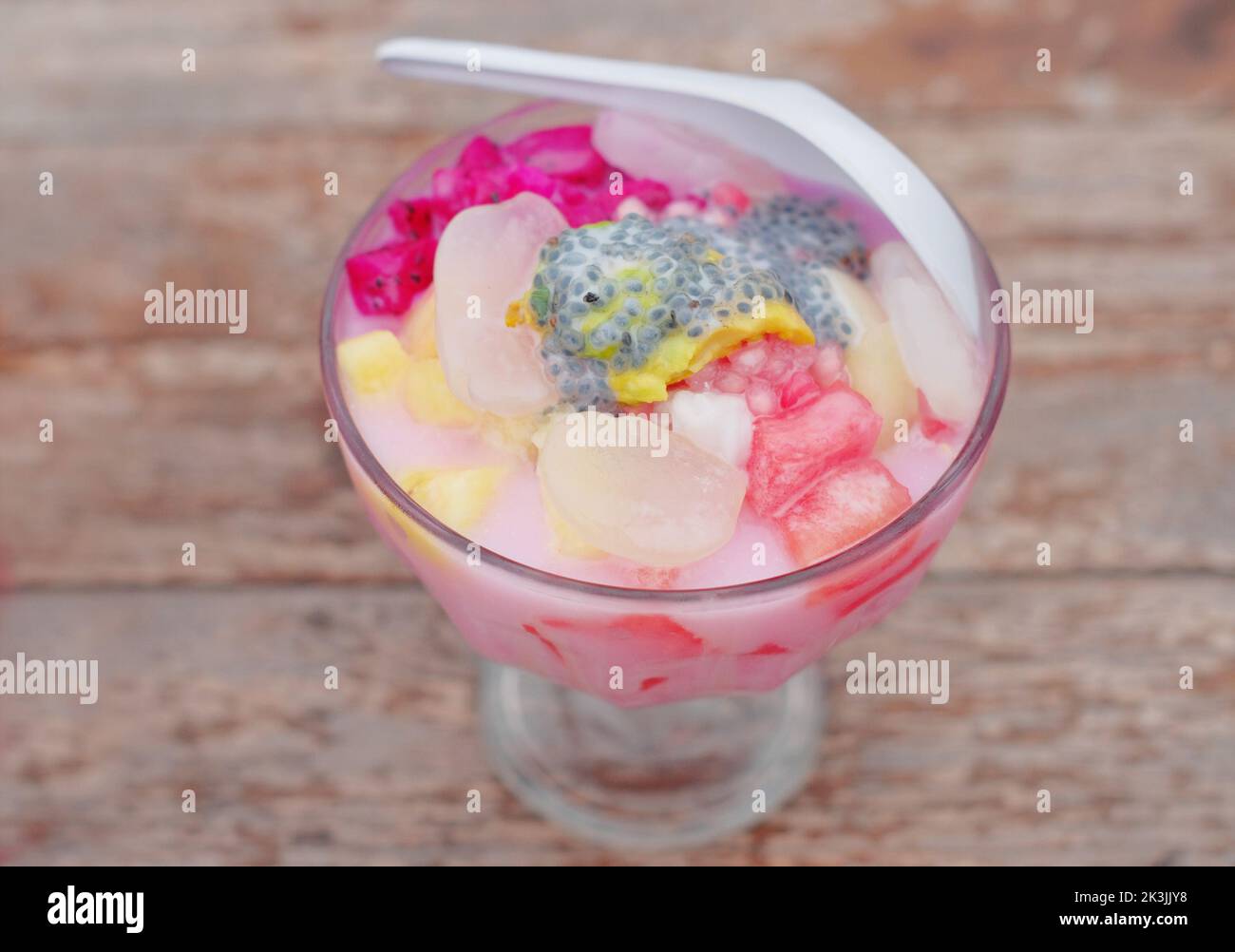 Fresh fruit soup in a glass. Delicious fruit soup isolated on the table ...