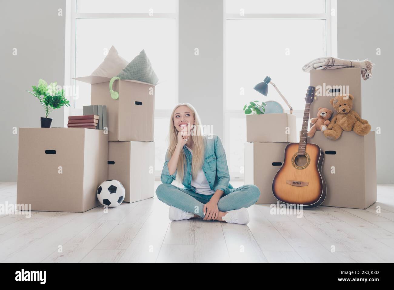 Photo of dreamy cute young girl wear jeans shirt moving new house ...