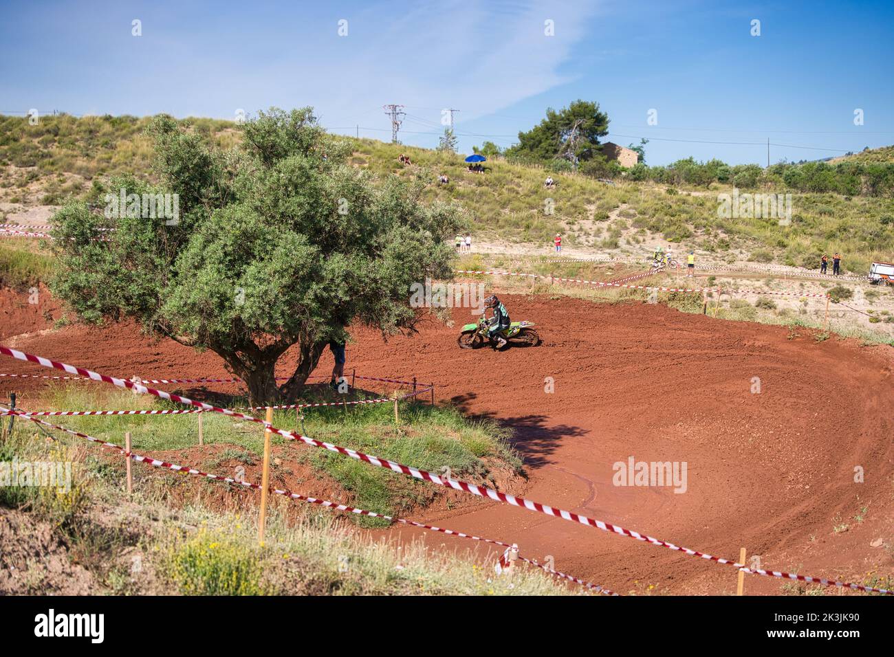 A motocross rider racing on an off-road circuit Stock Photo - Alamy